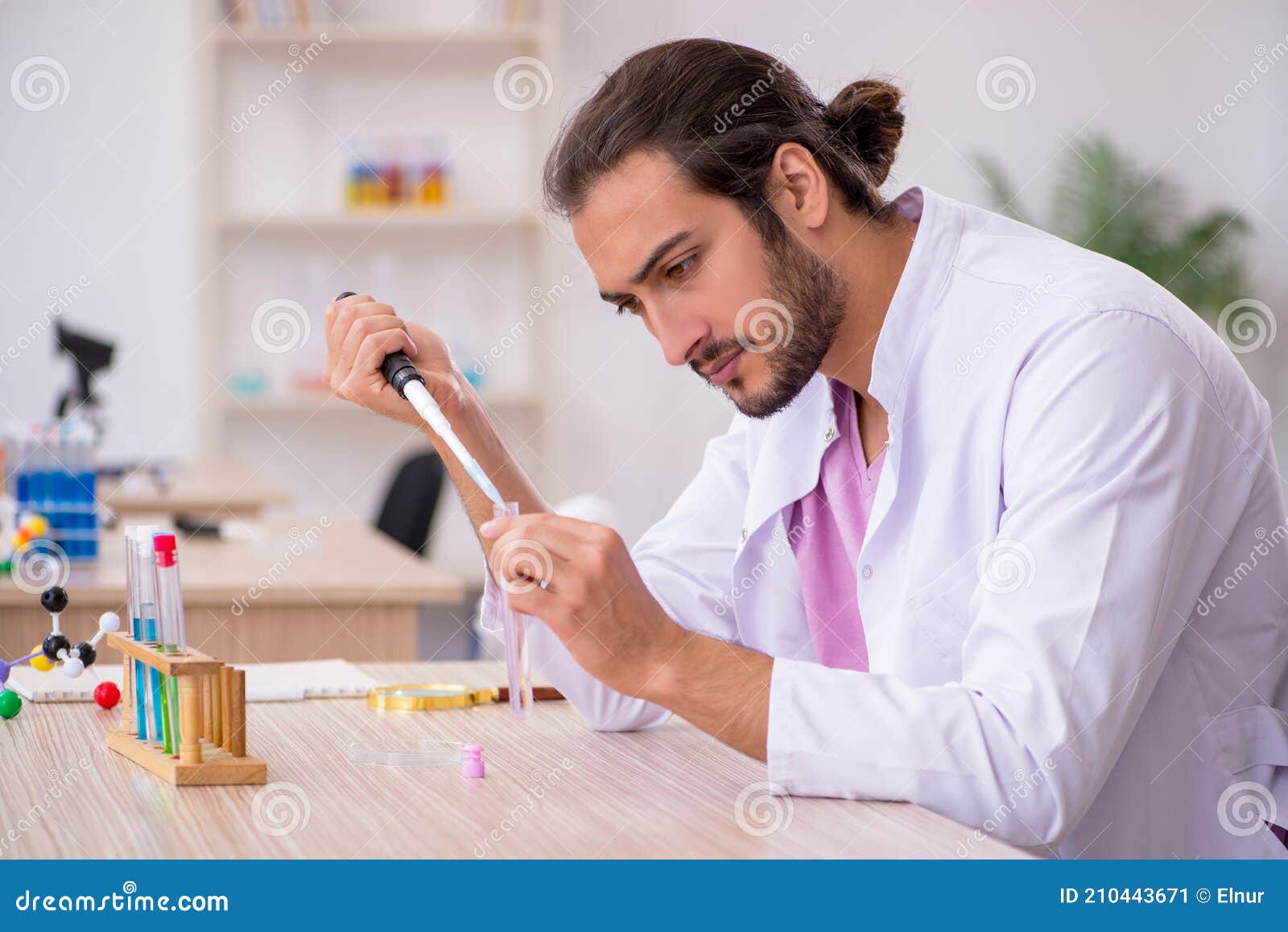 Young Male Chemist Sitting at the Desk in the Classroom Stock Image ...