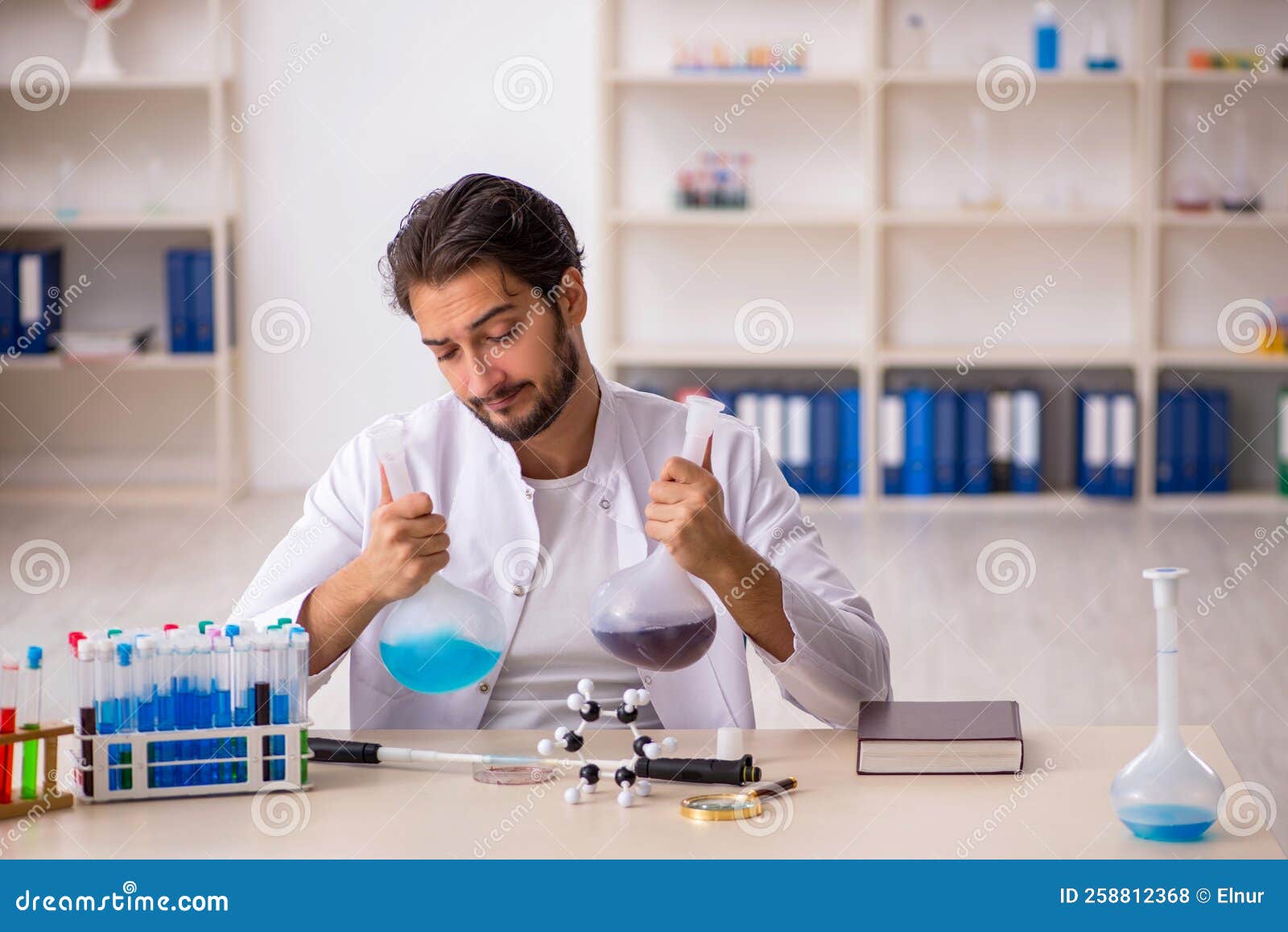 Young Male Chemist Working at the Lab Stock Photo - Image of chemical ...