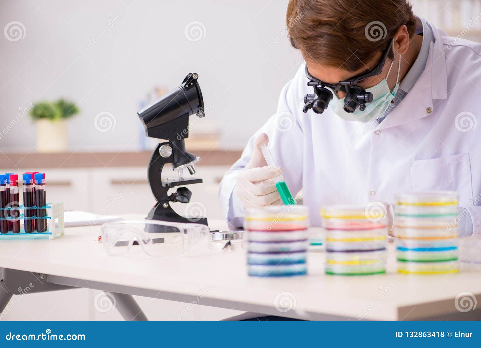 The Young Chemist Working in the Lab Stock Photo - Image of ...