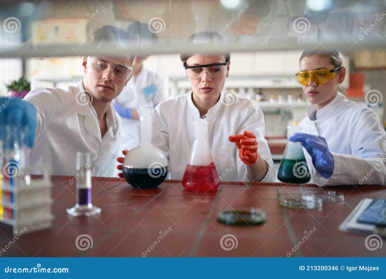 Young Chemistry Students Work with Caution while Handling Dangerous ...