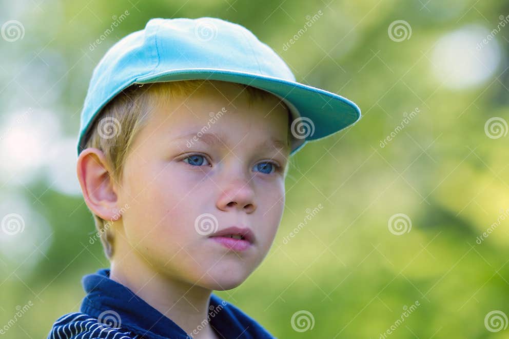 Young child with a cap stock image. Image of youth, blue - 16373041