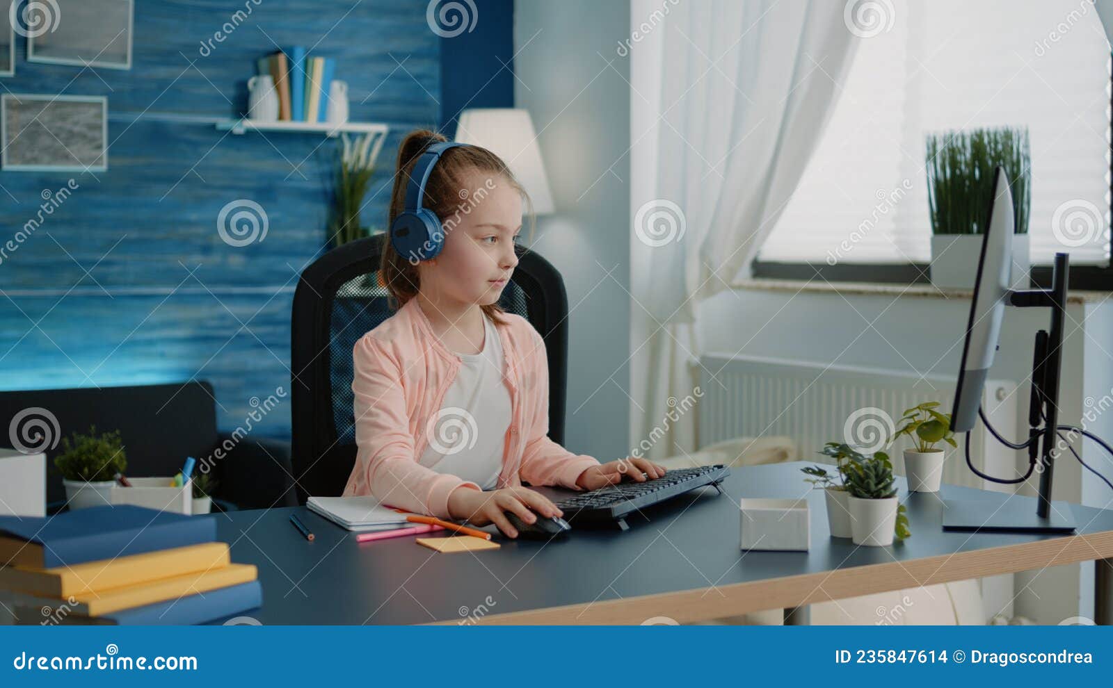 Young Child Drawing on Textbook and Using Computer Stock Photo - Image ...