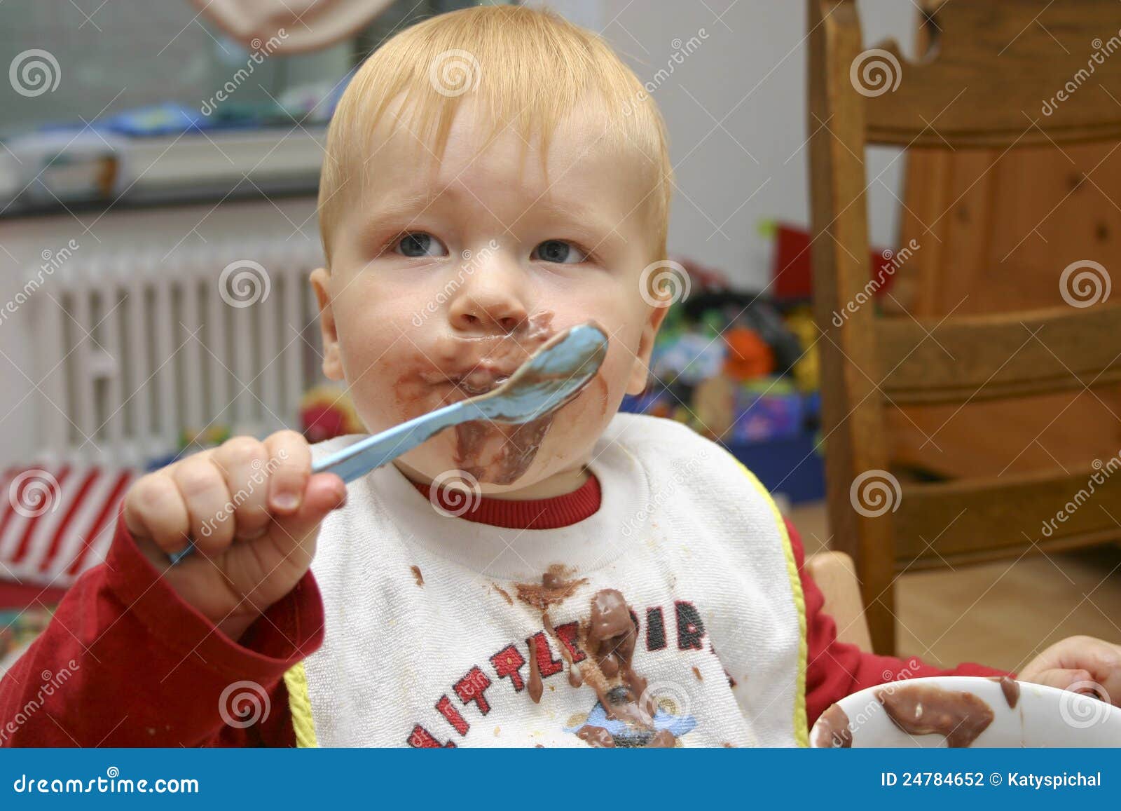 Young child eating stock photo. Image of funny, spoon - 24784652