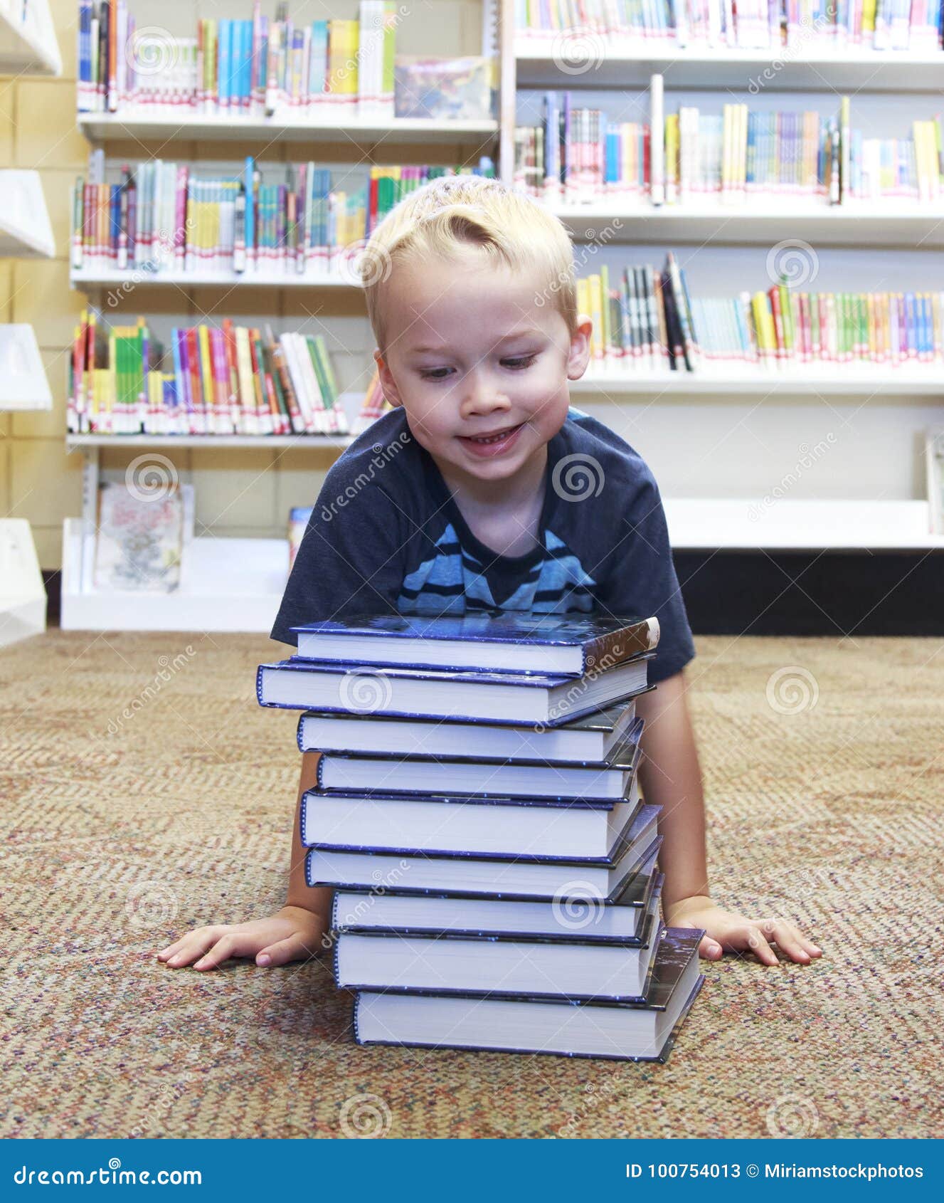 Young Child Excited about Reading His Stack of Books at the Library ...