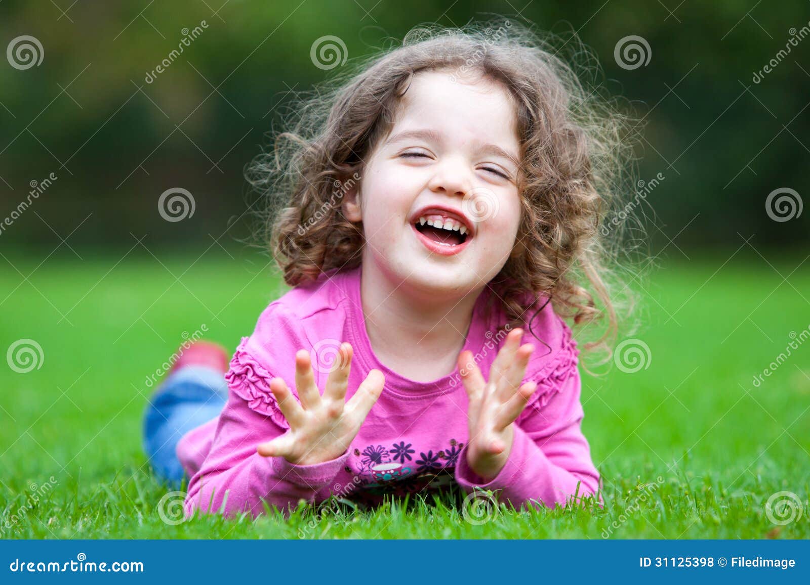 Young Child in the Grass stock photo. Image of outdoors - 31125398