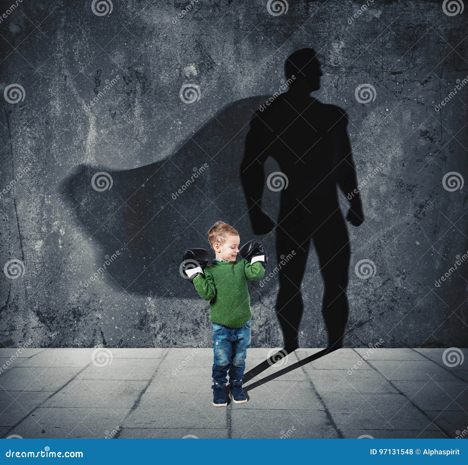 Young Child With His Shadow Of Super Hero On The Wall. Stock ...