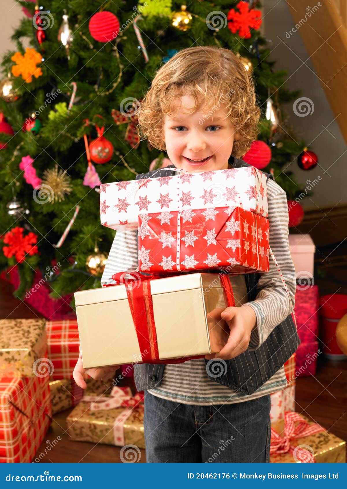 Young child holding gifts stock photo. Image of year - 20462176
