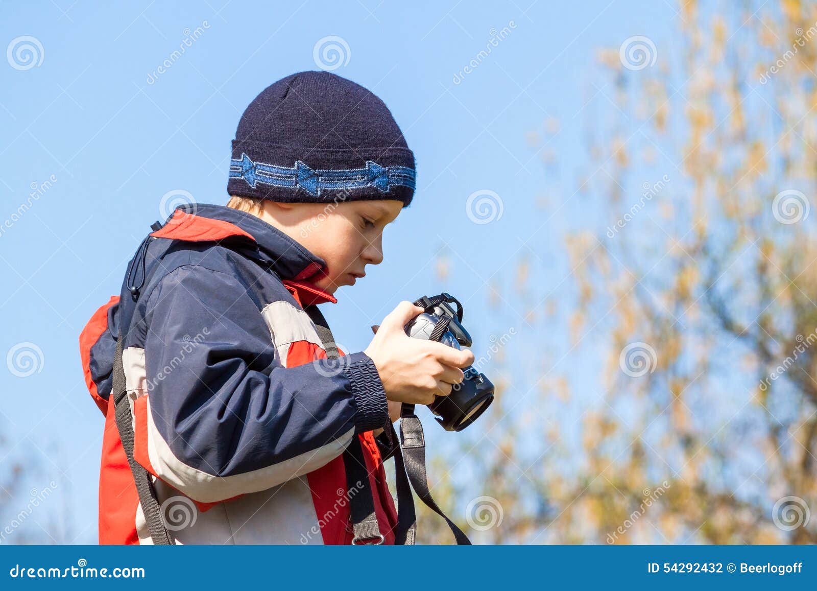 Young Child Holding and Viewing Photos on the Camera Stock Photo ...