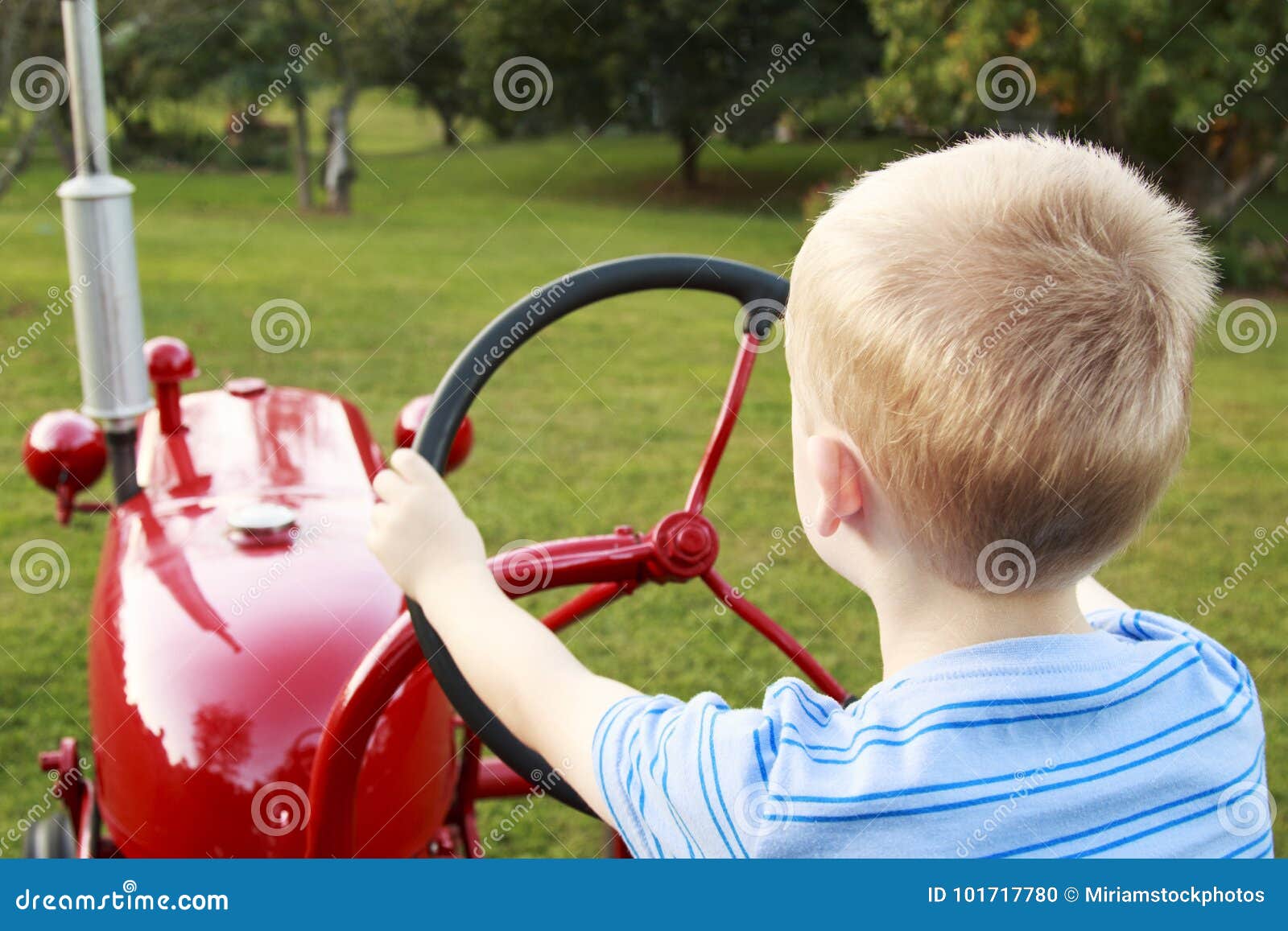 Young Child Pretending To Drive an Old Tractor Stock Photo - Image of ...