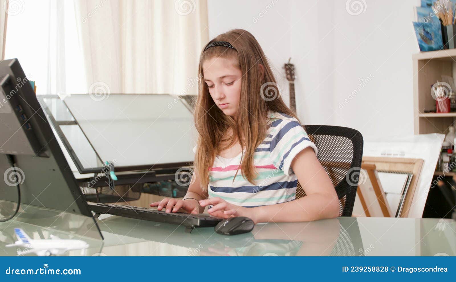 Young Child Sitting at Desk in Front of Computer Typing Online Homework ...