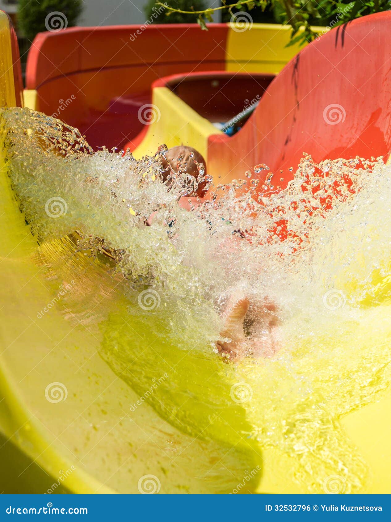 Young Child Sliding Down a Waterslide Stock Photo - Image of summer ...