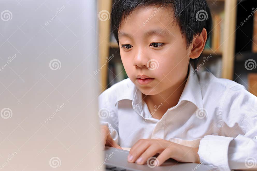 Young Child Working Hard in Front of Computer Stock Image - Image of ...
