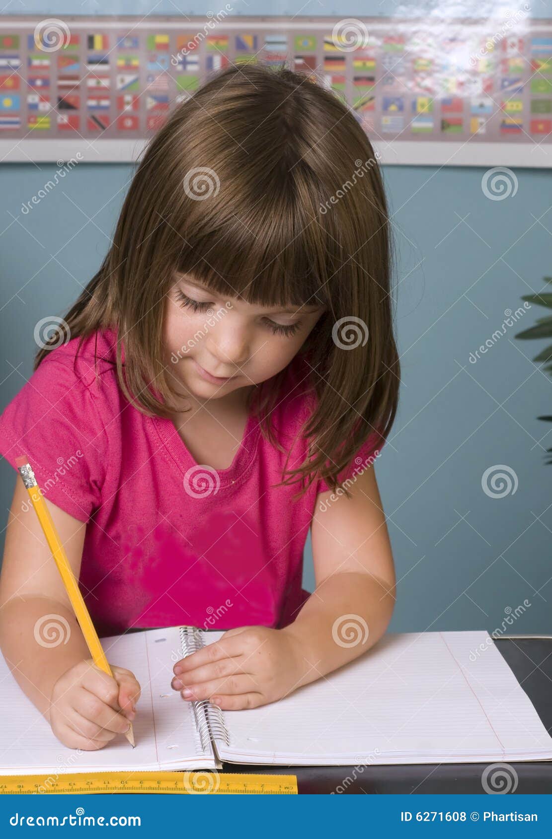 Young Child Working at Her Desk in Class Room Stock Photo - Image of ...