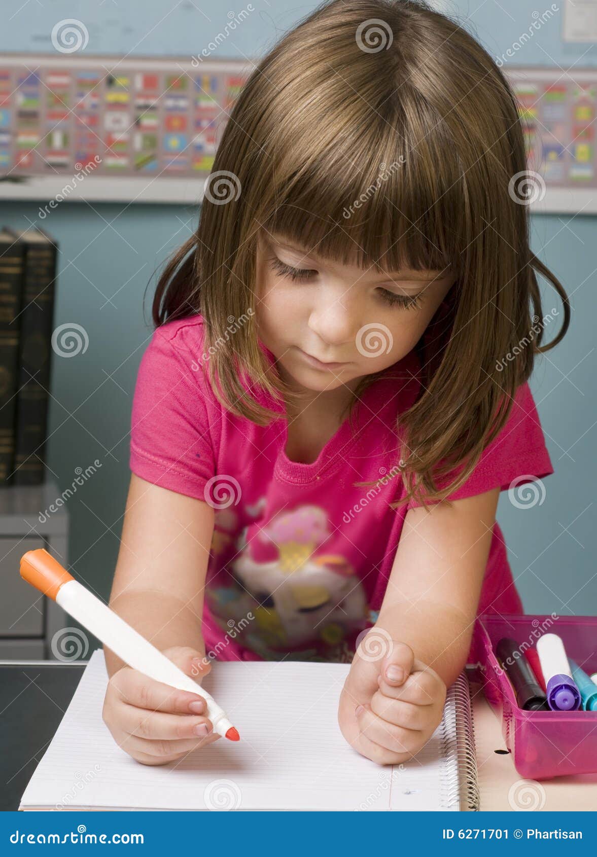 Young Child Working at Her Desk in Class Room Stock Image - Image of ...