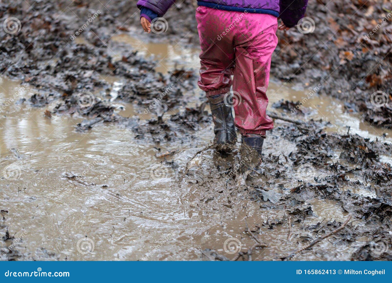 Young Children Playing in a Mud Puddle Stock Image - Image of playful ...