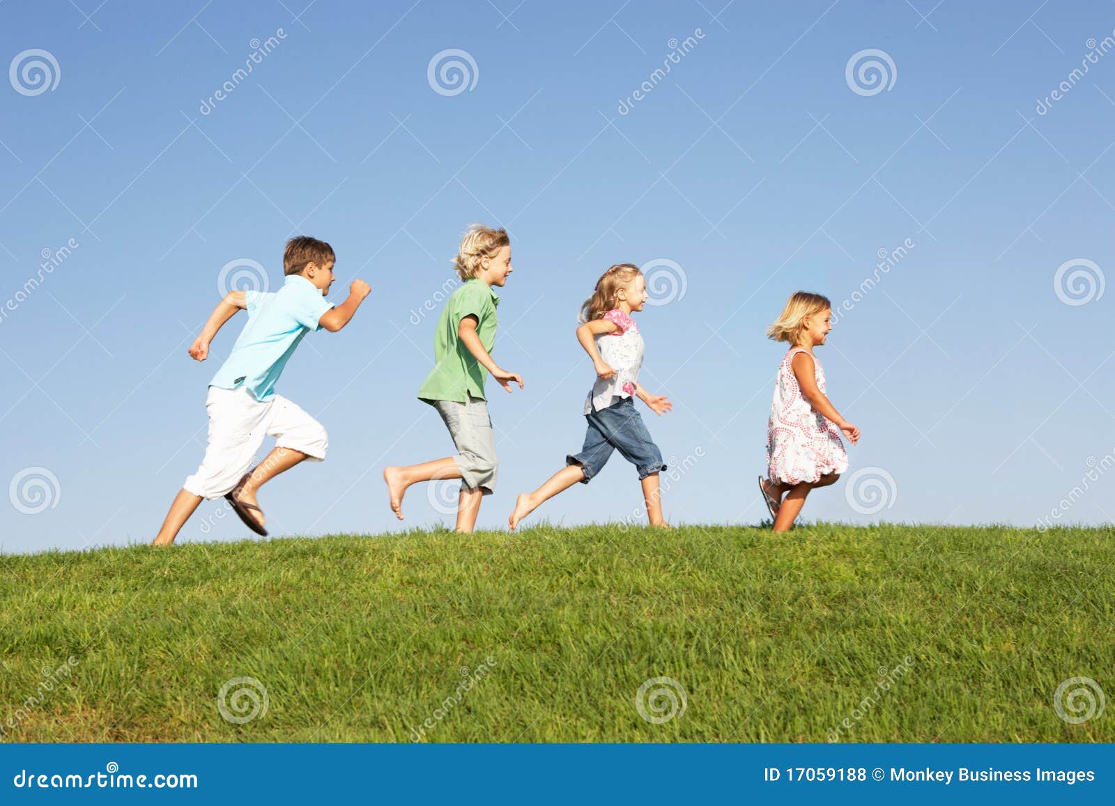 Young Children Running through Field Stock Photo - Image of running ...