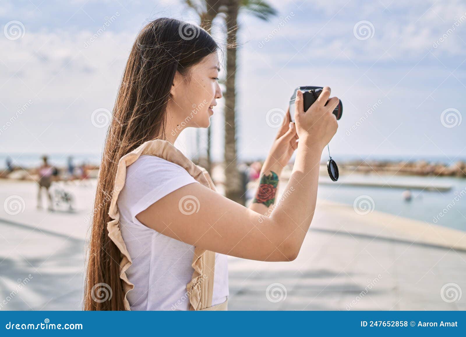 Young Chinese Girl Smiling Happy Using Camera at the Promenade Stock ...