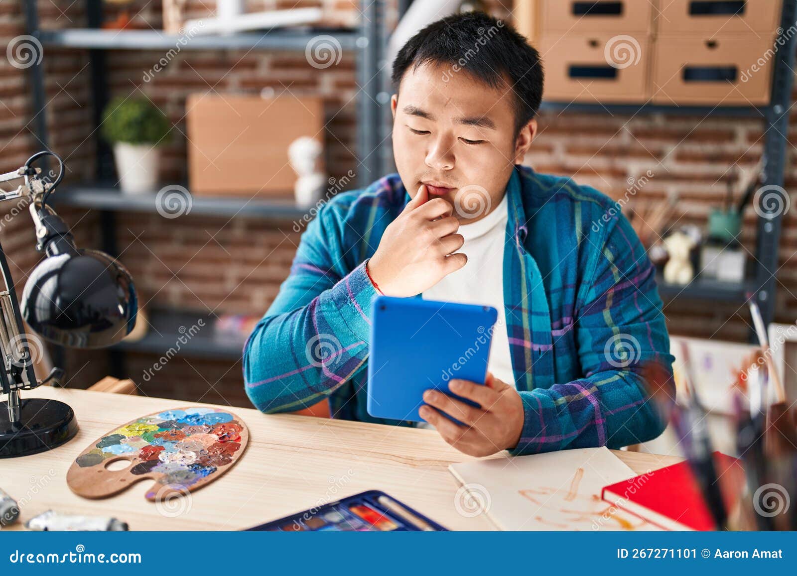 Young Chinese Man Artist Using Touchpad at Art Studio Stock Image ...