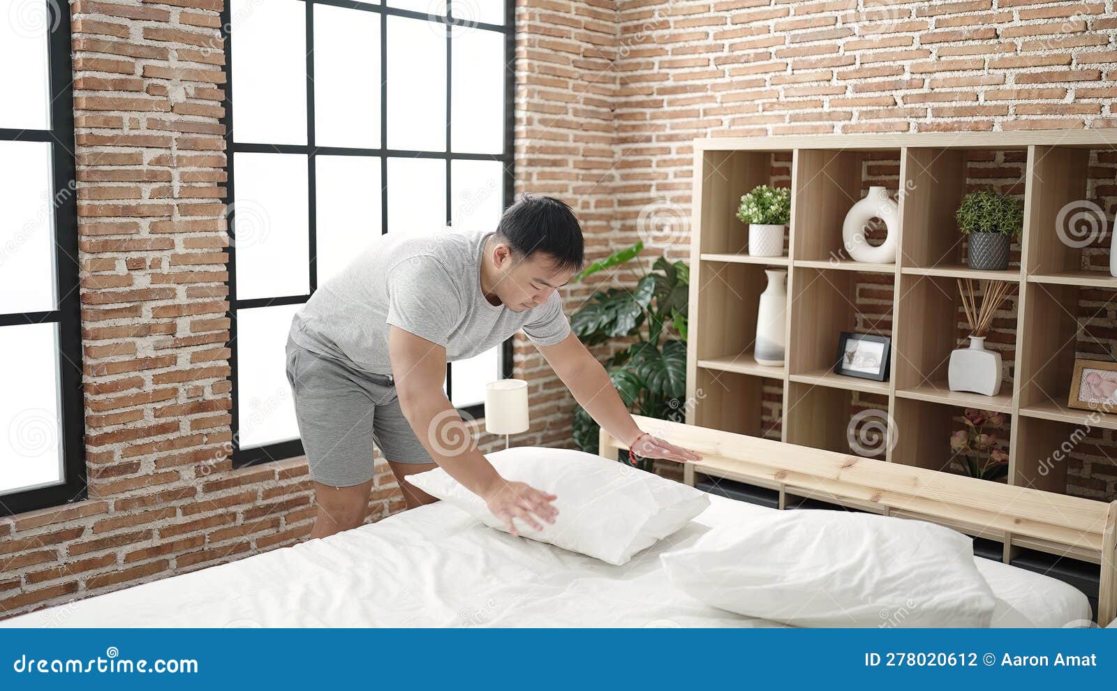 Young Chinese Man Make Bed at Bedroom Stock Photo - Image of pajamas ...