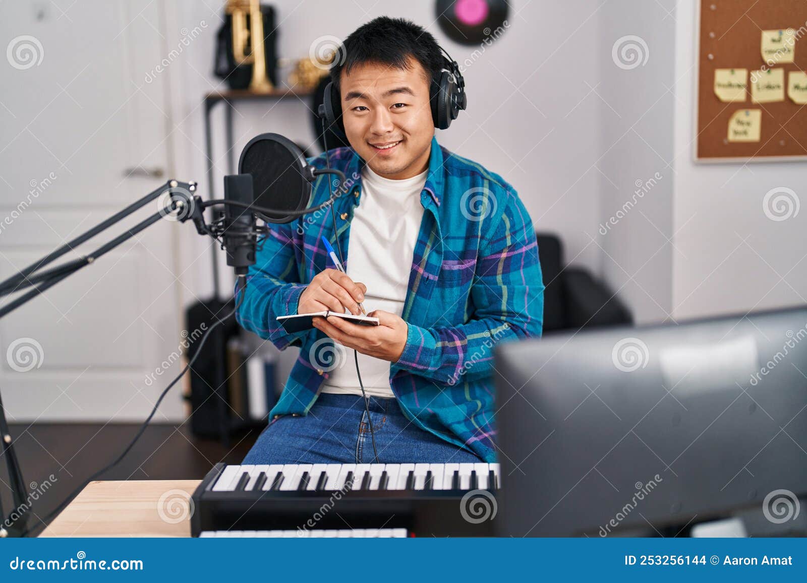 Young Chinese Man Singer Composing Song at Music Studio Stock Photo ...