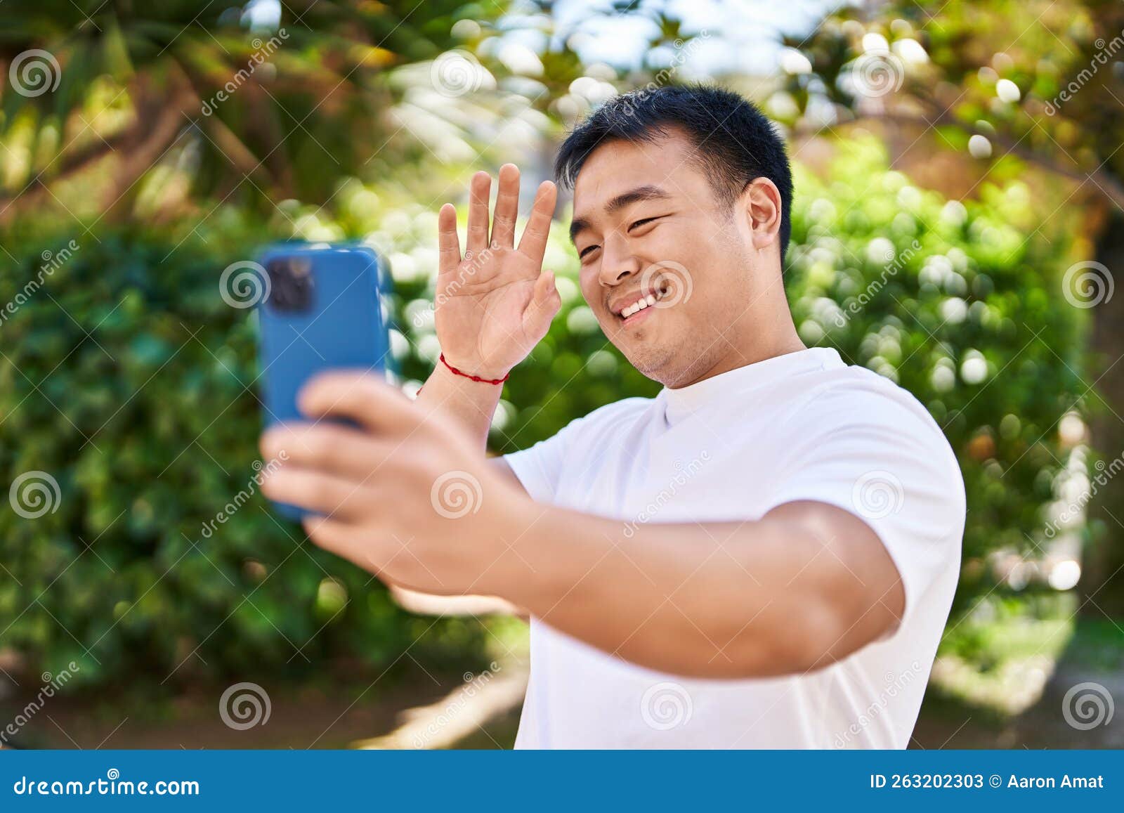 Young Chinese Man Smiling Confident Having Video Call at Park Stock ...