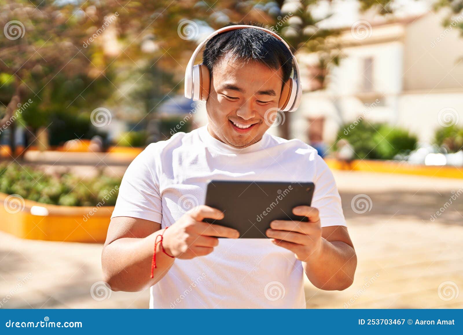 Young Chinese Man Smiling Confident Watching Video at Park Stock Image ...
