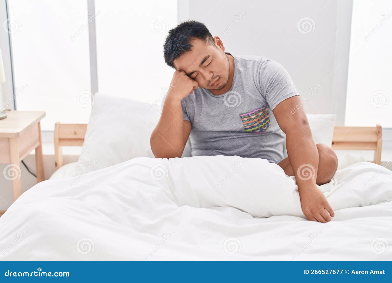 Young Chinese Man Stressed Sitting on Bed at Bedroom Stock Image ...