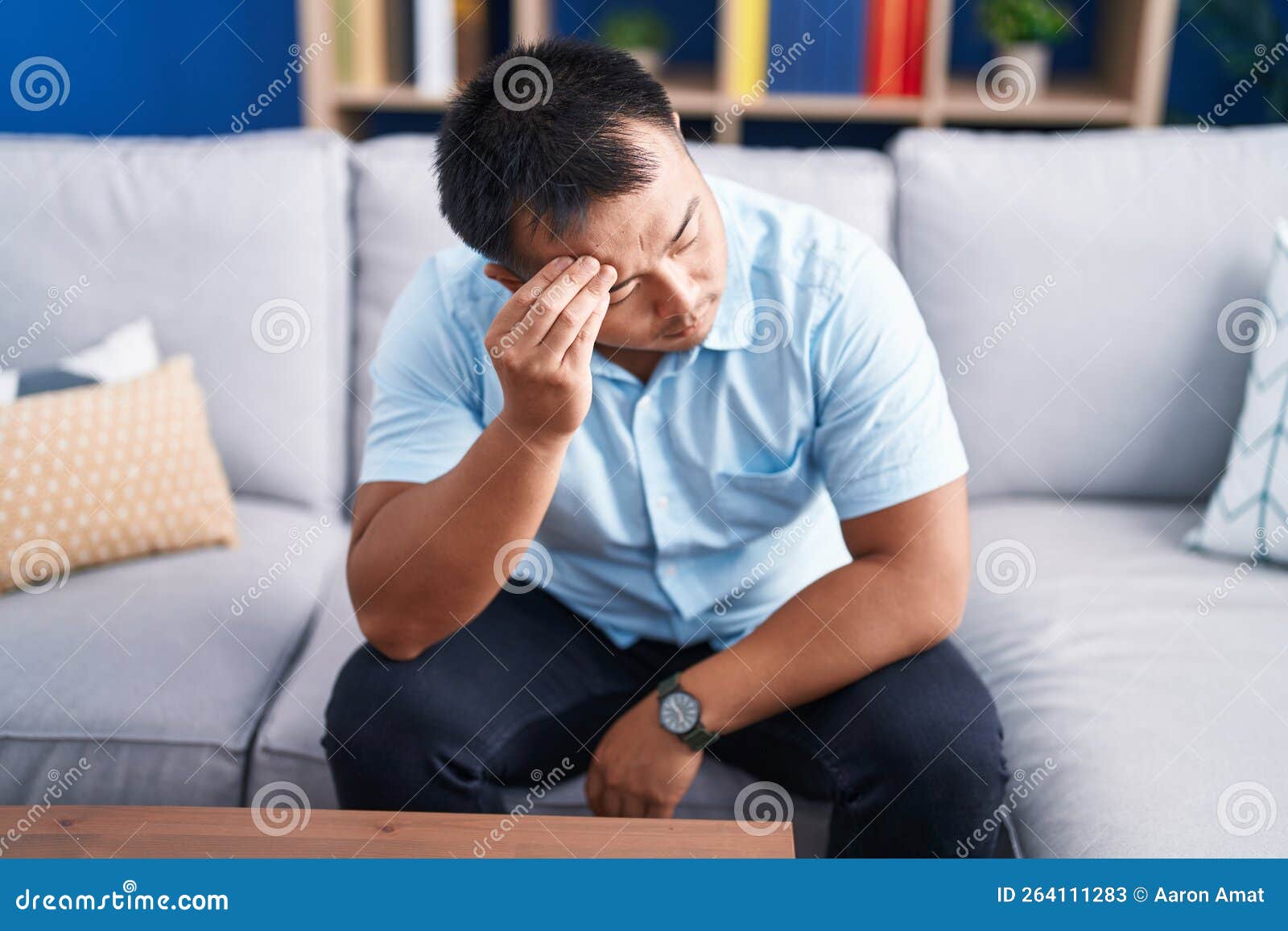 Young Chinese Man Stressed Sitting on Sofa at Home Stock Image - Image ...
