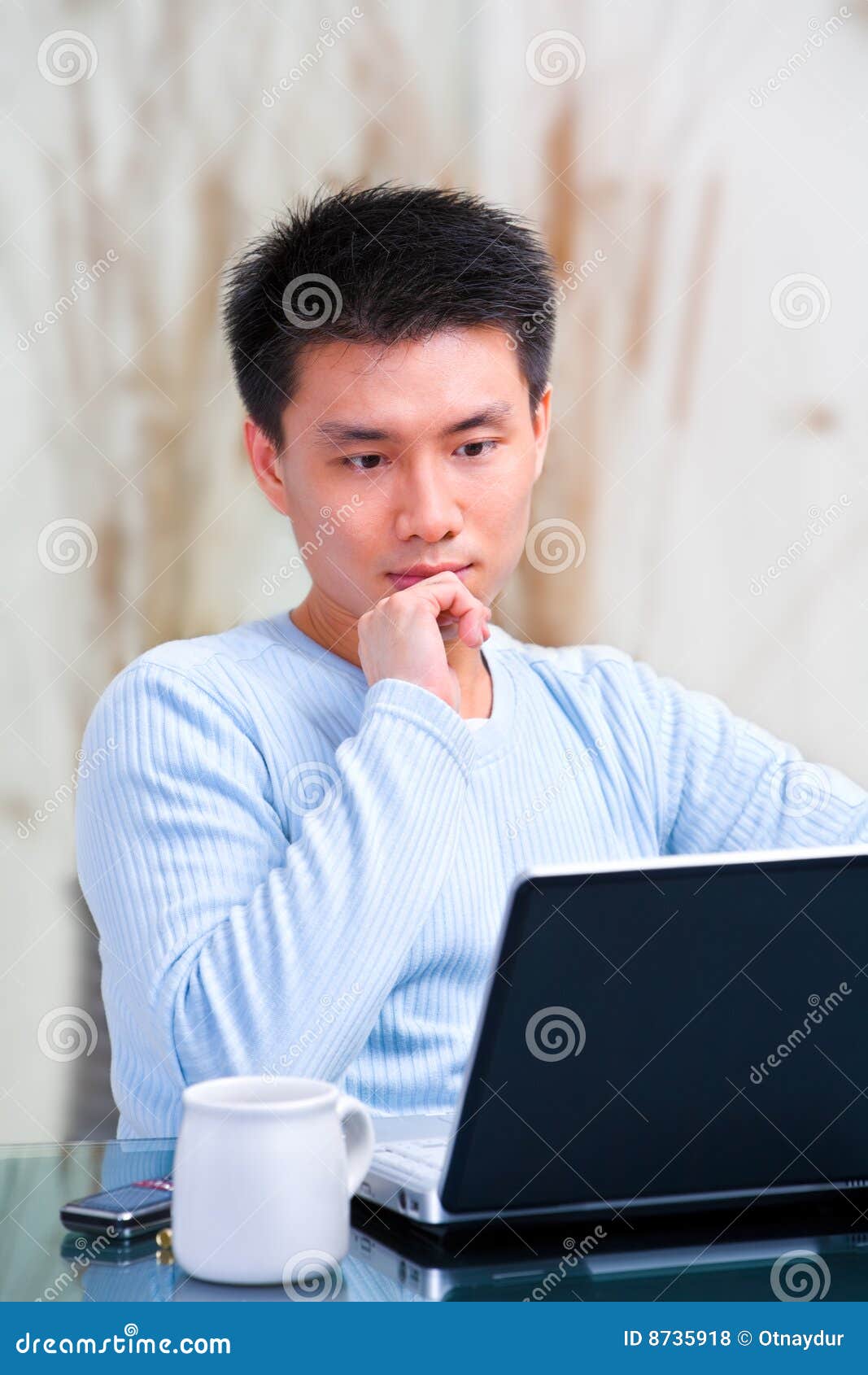 Young Chinese Man Thinking in Front of His Laptop Stock Photo - Image ...