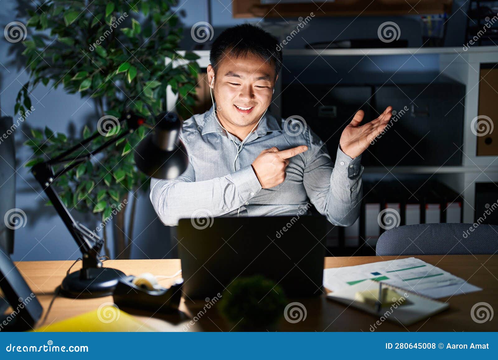 Young Chinese Man Working Using Computer Laptop at Night Amazed and ...