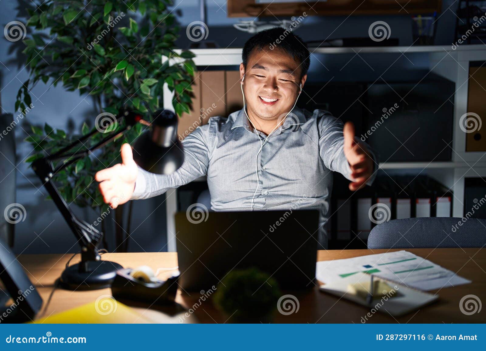 Young Chinese Man Working Using Computer Laptop at Night Looking at the ...