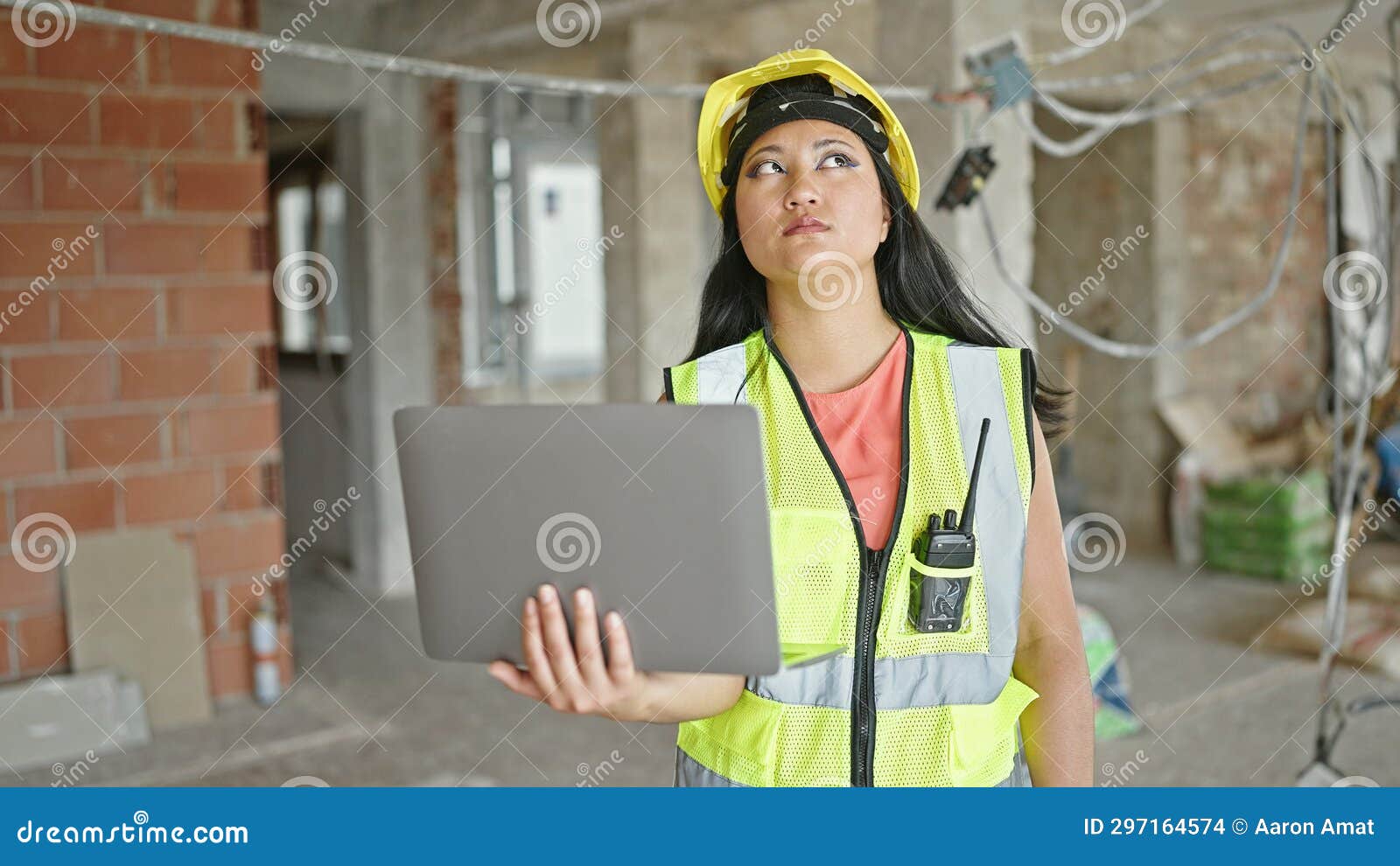 Young Chinese Woman Architect Using Laptop Looking Around at ...