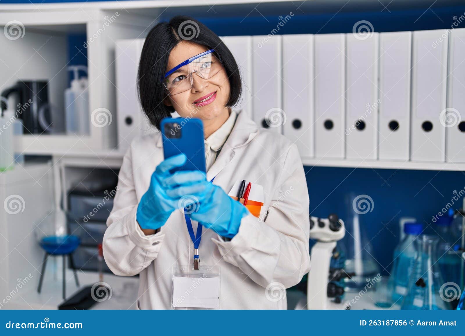 Young Chinese Woman Scientist Using Smartphone Working at Laboratory ...