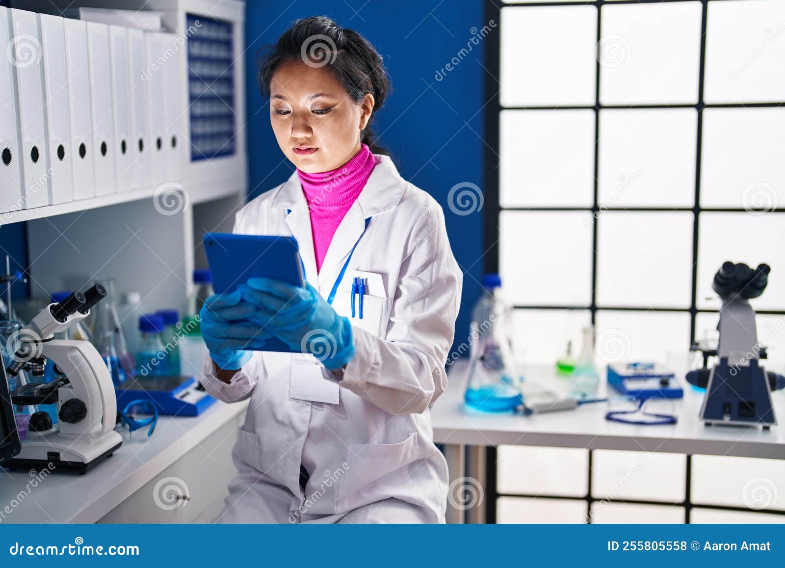 Young Chinese Woman Scientist Using Touchpad at Laboratory Stock Photo ...