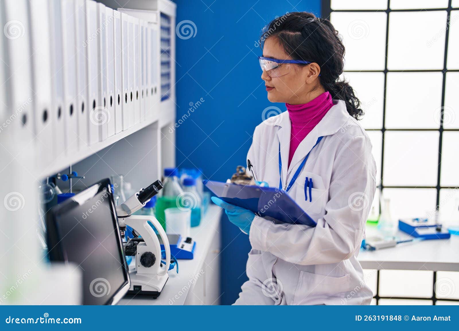 Young Chinese Woman Scientist Write on Clipboard at Laboratory Stock ...