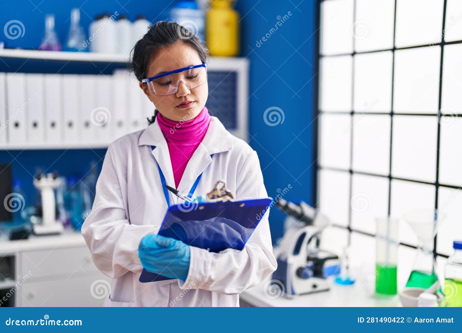 Young Chinese Woman Scientist Write on Clipboard at Laboratory Stock ...