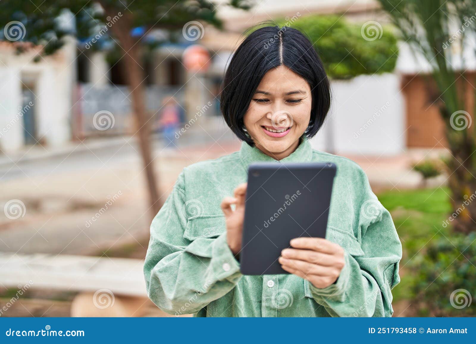 Young Chinese Woman Smiling Confident Using Touchpad at Park Stock ...