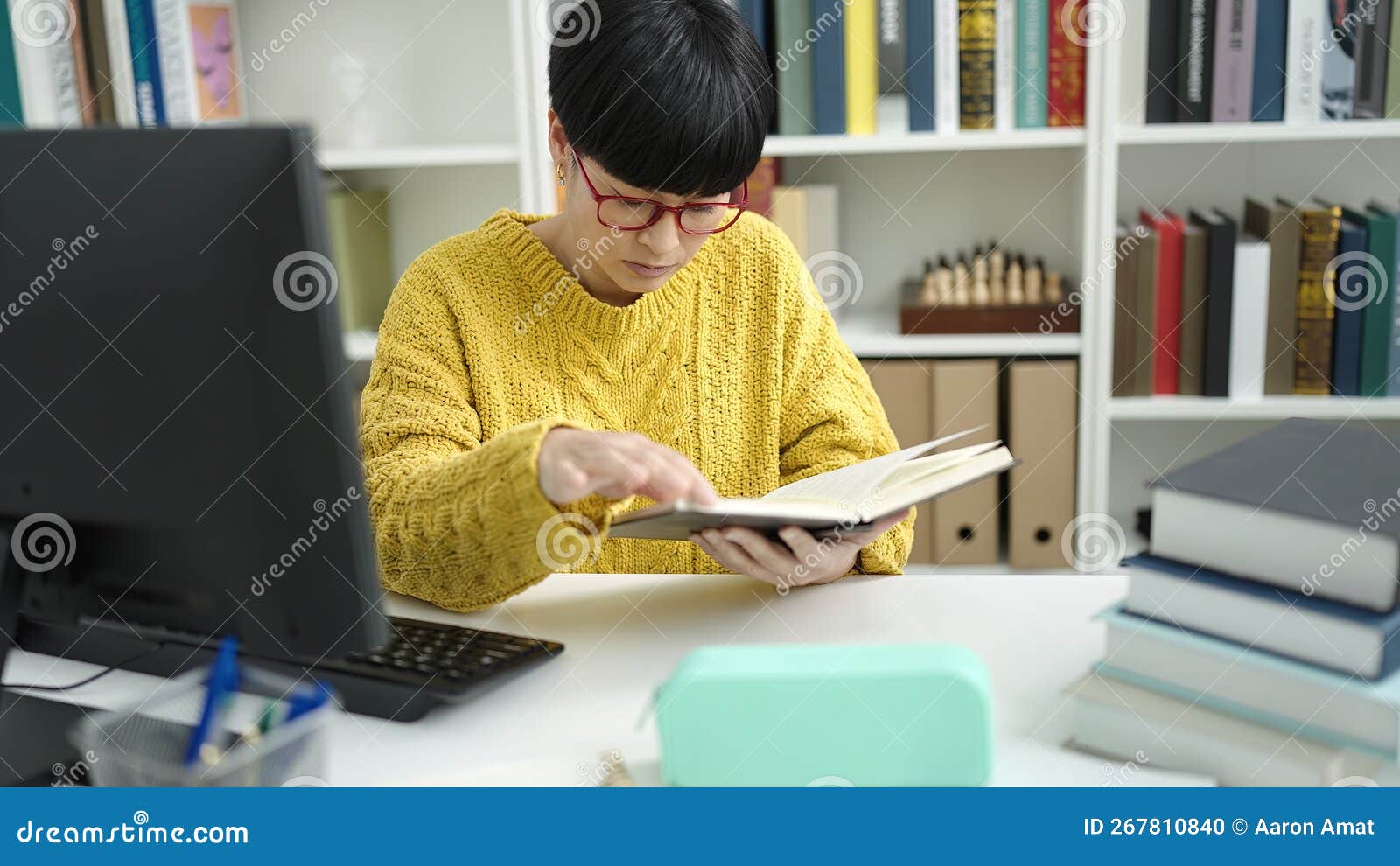 Young Chinese Woman Student Reading Book Studying at Library University ...