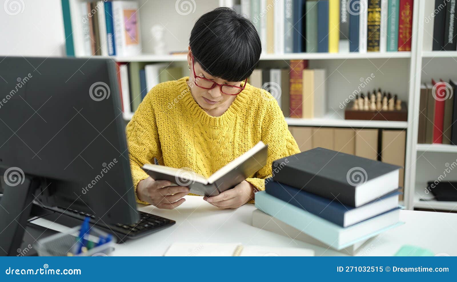 Young Chinese Woman Student Reading Book Studying at Library University ...