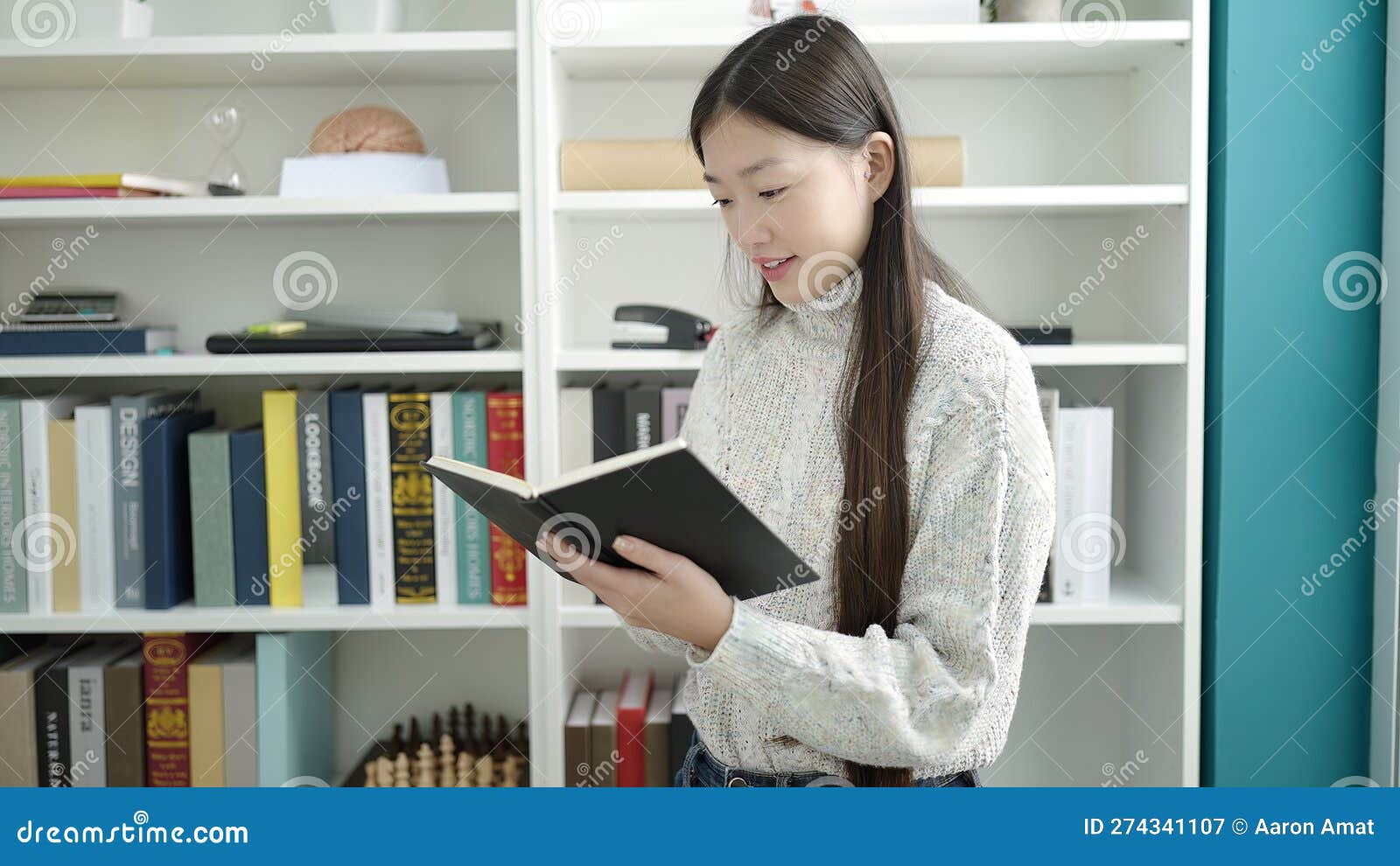 Young Chinese Woman Student Reading Book Studying at Library University ...