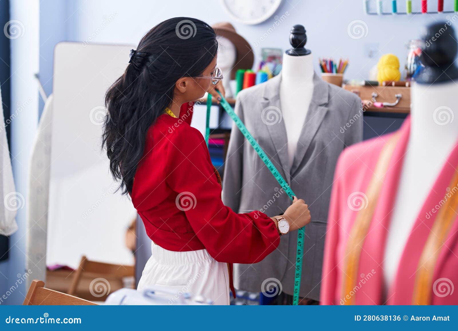 Young Chinese Woman Tailor Measuring Jacket at Atelier Stock Photo ...