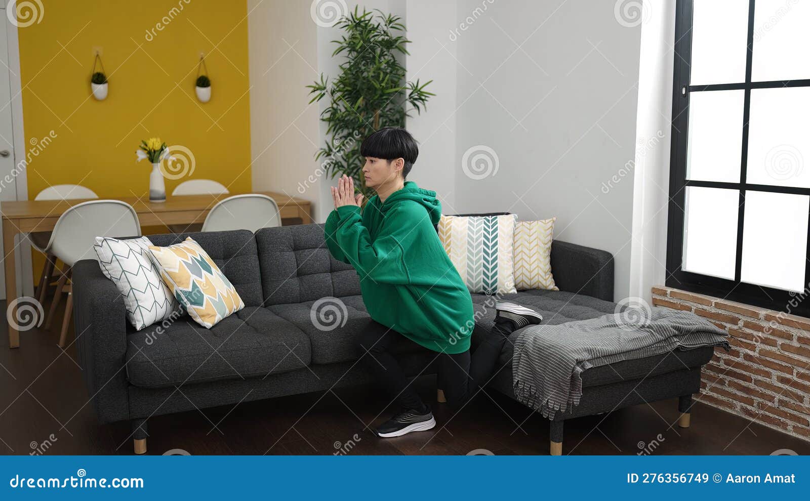 Young Chinese Woman Training Legs Exercise Standing at Home Stock Image ...