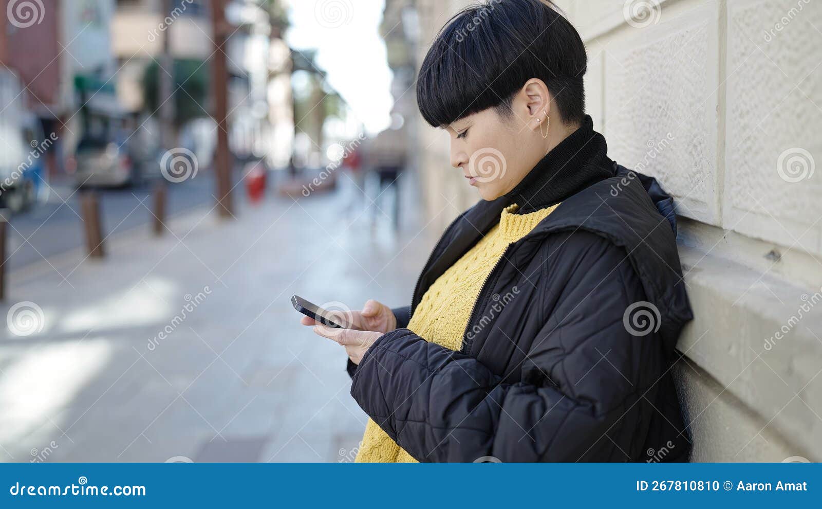 Young Chinese Woman Using Smartphone at Street Stock Photo - Image of ...