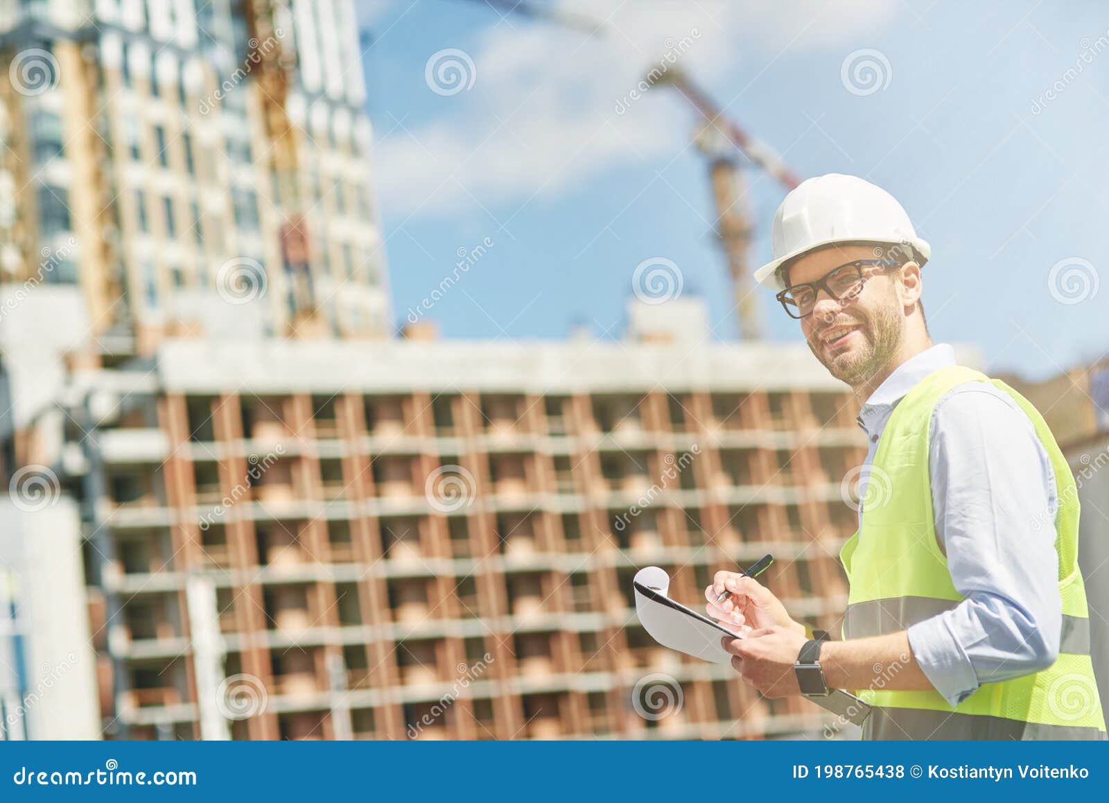 Young Civil Engineer or Construction Supervisor Wearing Helmet Smiling ...