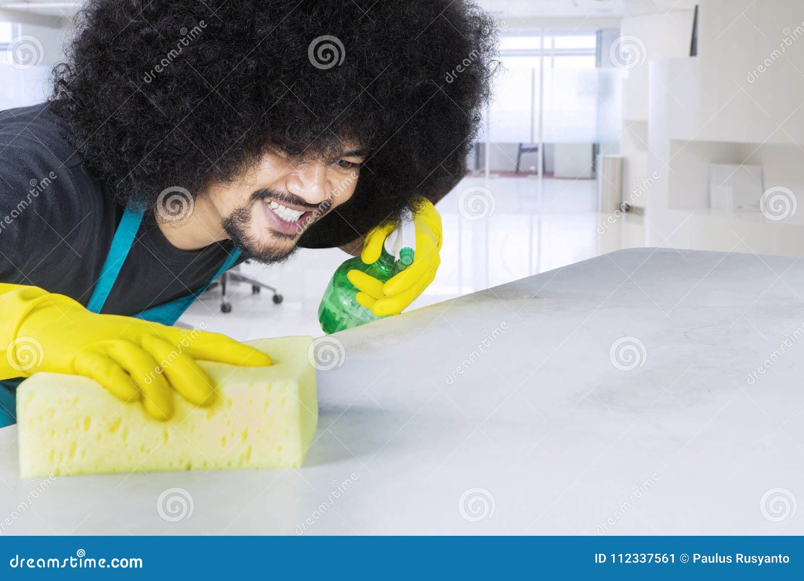 Young Cleaning Service Professional Cleaning the Desk Stock Image ...