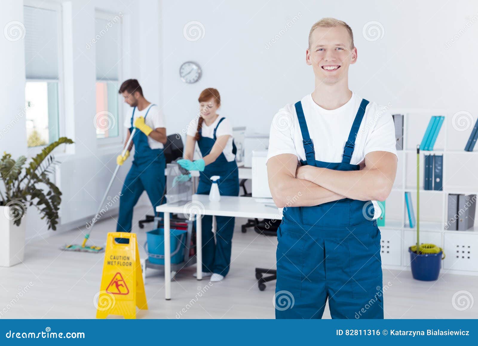 Young cleaning staff stock photo. Image of uniform, professional - 82811316