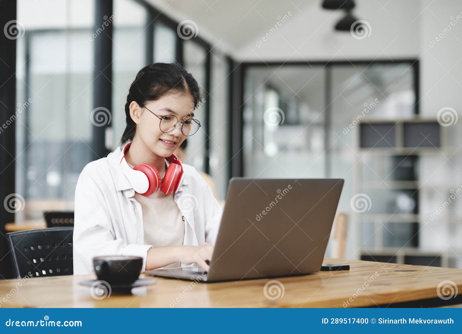 Young Collage Student Using Computer and Mobile Device Studying Online ...