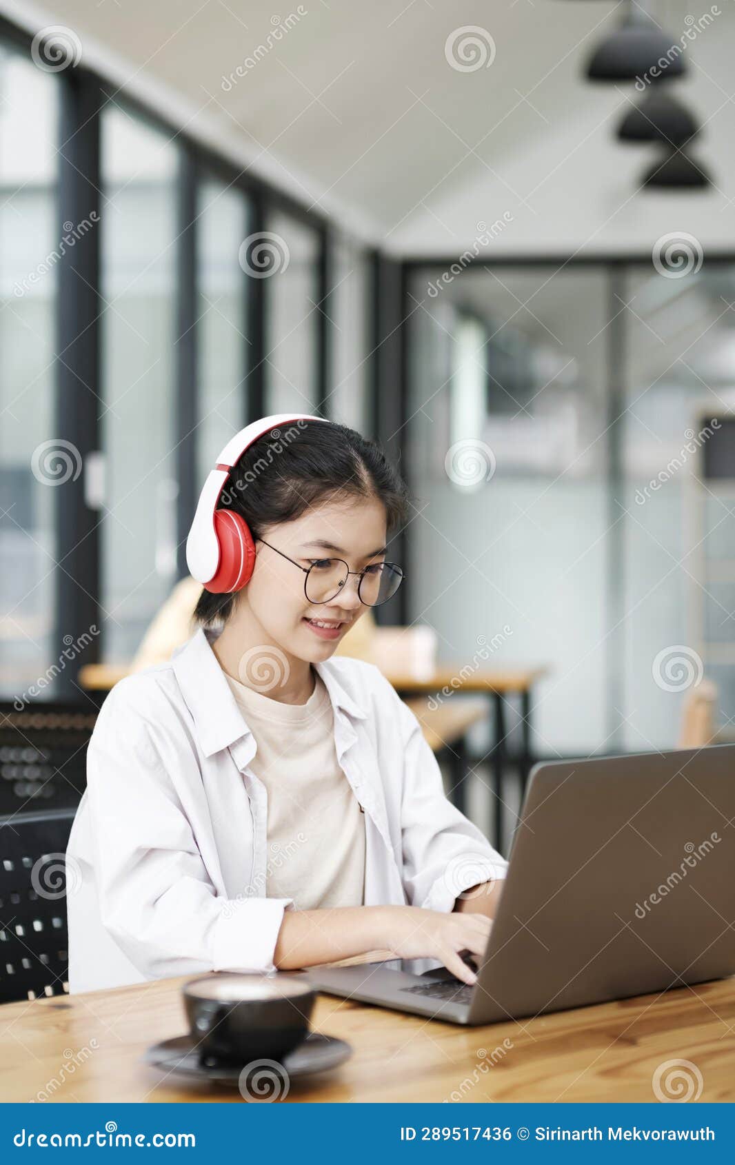 Young Collage Student Using Computer and Mobile Device Studying Online ...