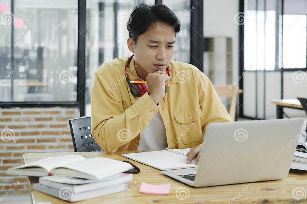Young Collage Student Using Computer and Mobile Device Studying Online ...