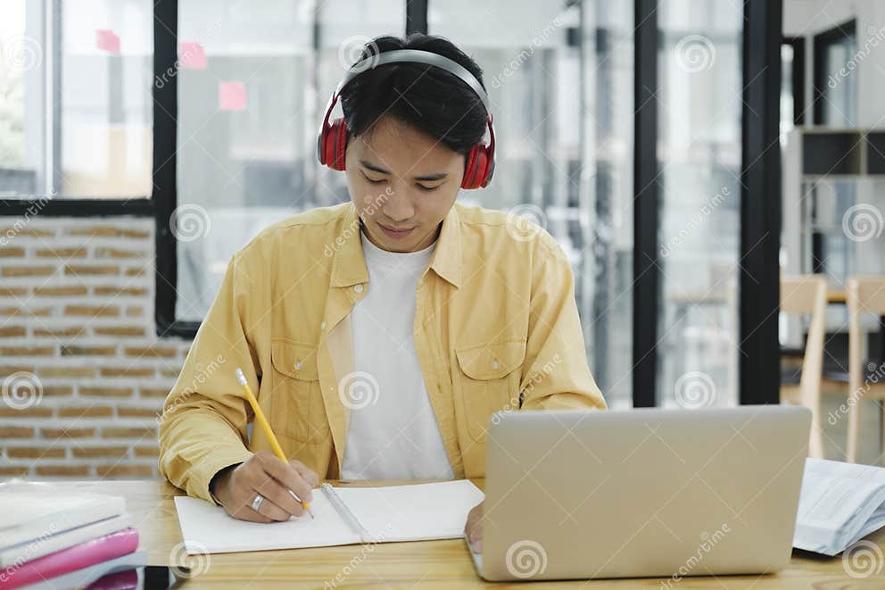 Young Collage Student Using Computer and Mobile Device Studying Online ...
